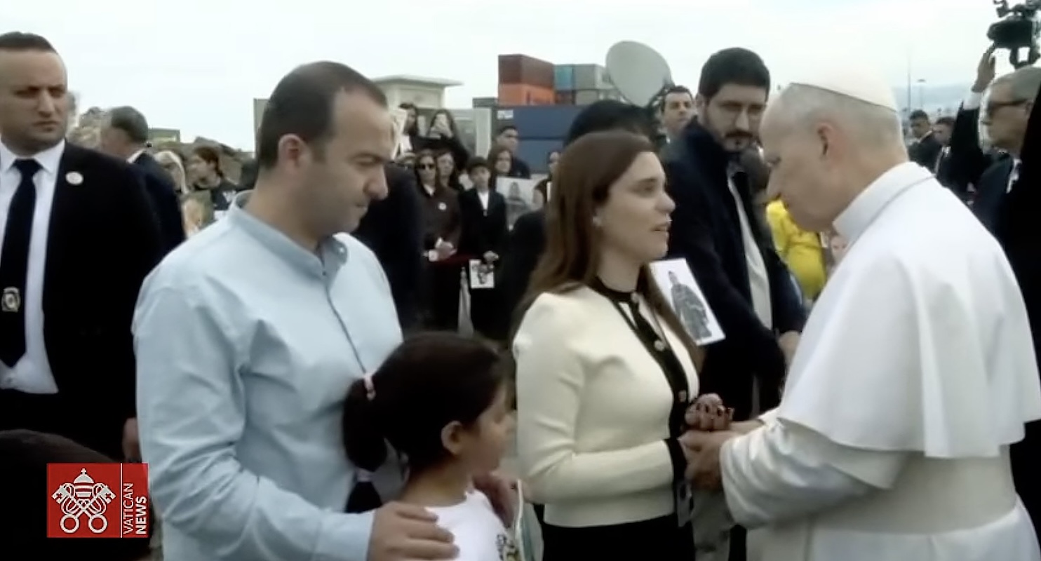 The story behind the young woman who wept while hugging Pope Leo in ...